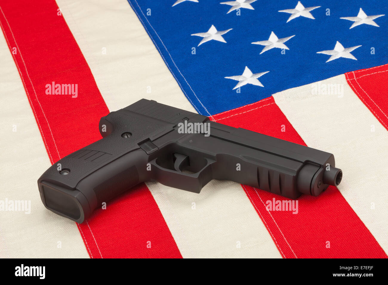 Handgun over USA flag Stock Photo - Alamy