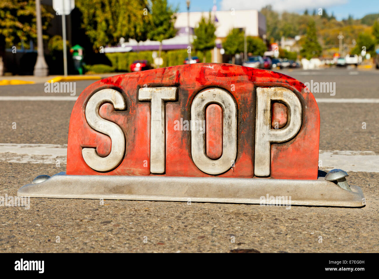 A stop sign set into the road on 3rd Street, Raymond just off Highway ...