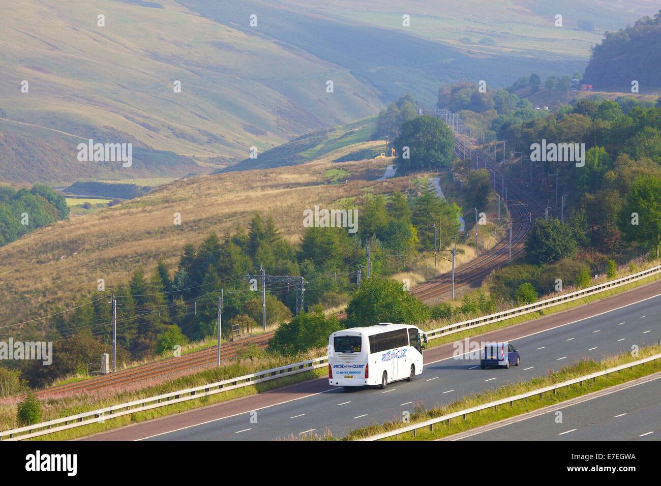 Passenger Coach on the M6 in the River Lune Valley. Howgills, Cumbria ...