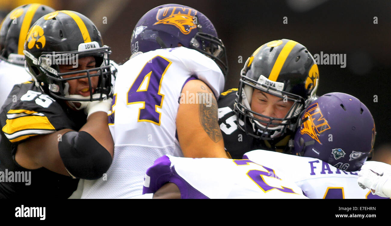 Iowa City, Iowa, USA. 30th Aug, 2014. Iowa's Mark Weisman (R) gets hit ...