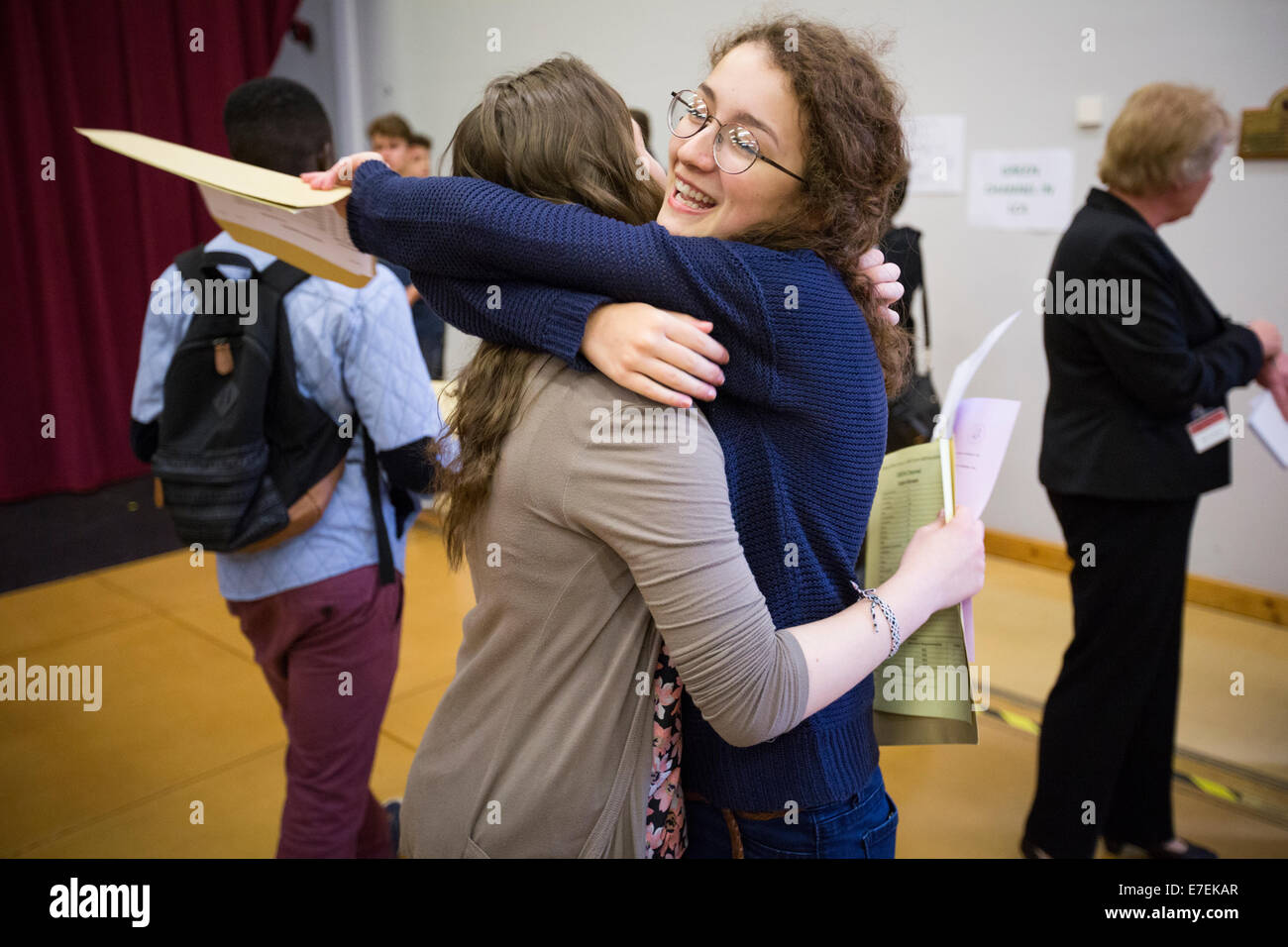 Education pupils celebrating hugging exam results students hi-res stock ...