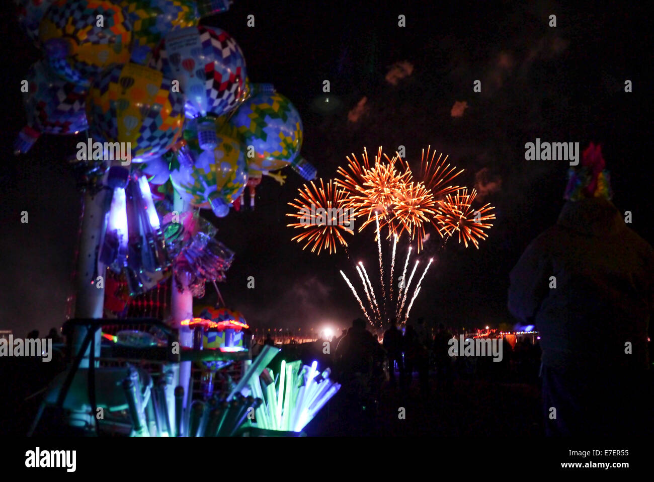 Fireworks light the night sky. The Albuquerque International Balloon ...