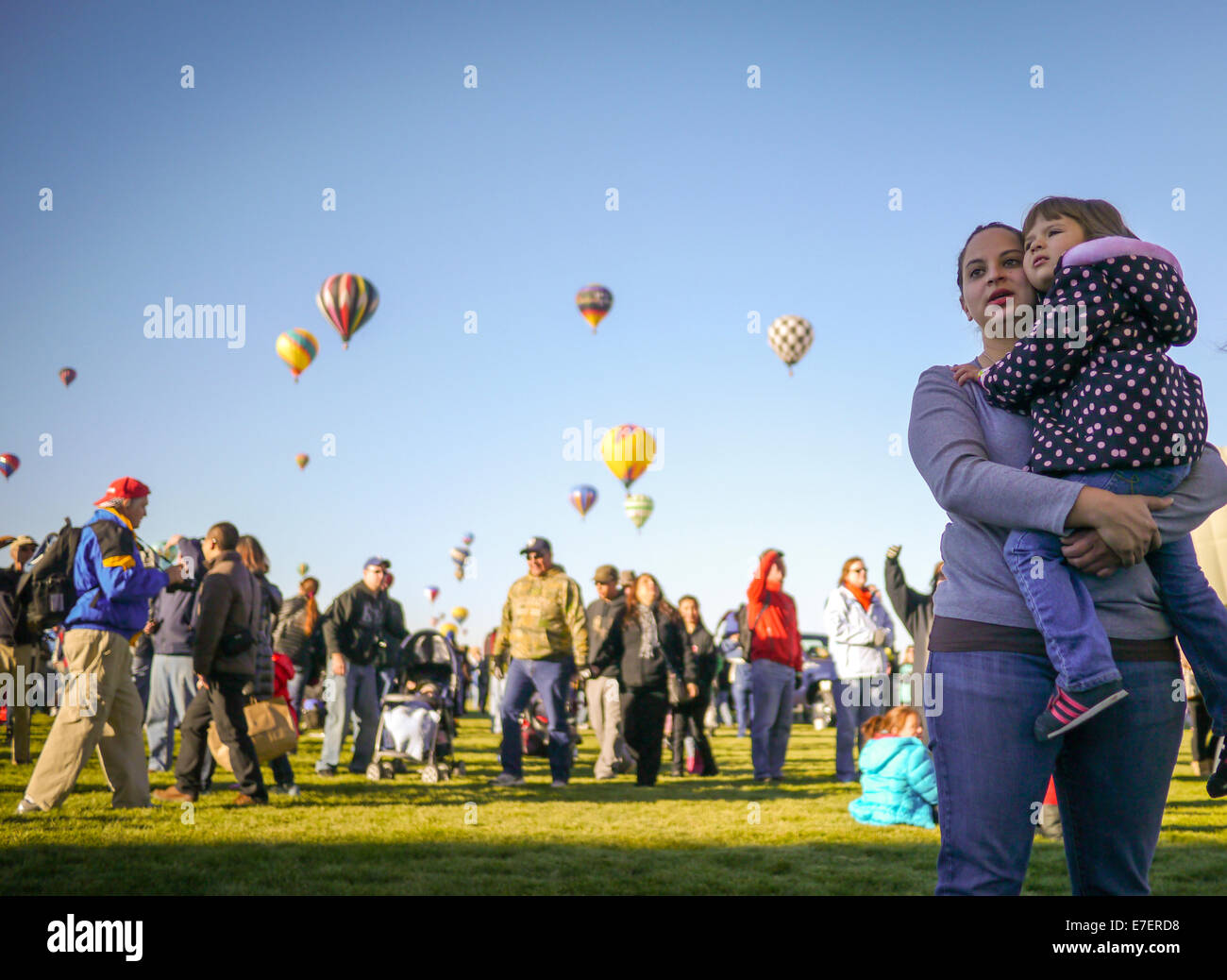 Spectators marvel at the color and magic of hot air balloons as they ...