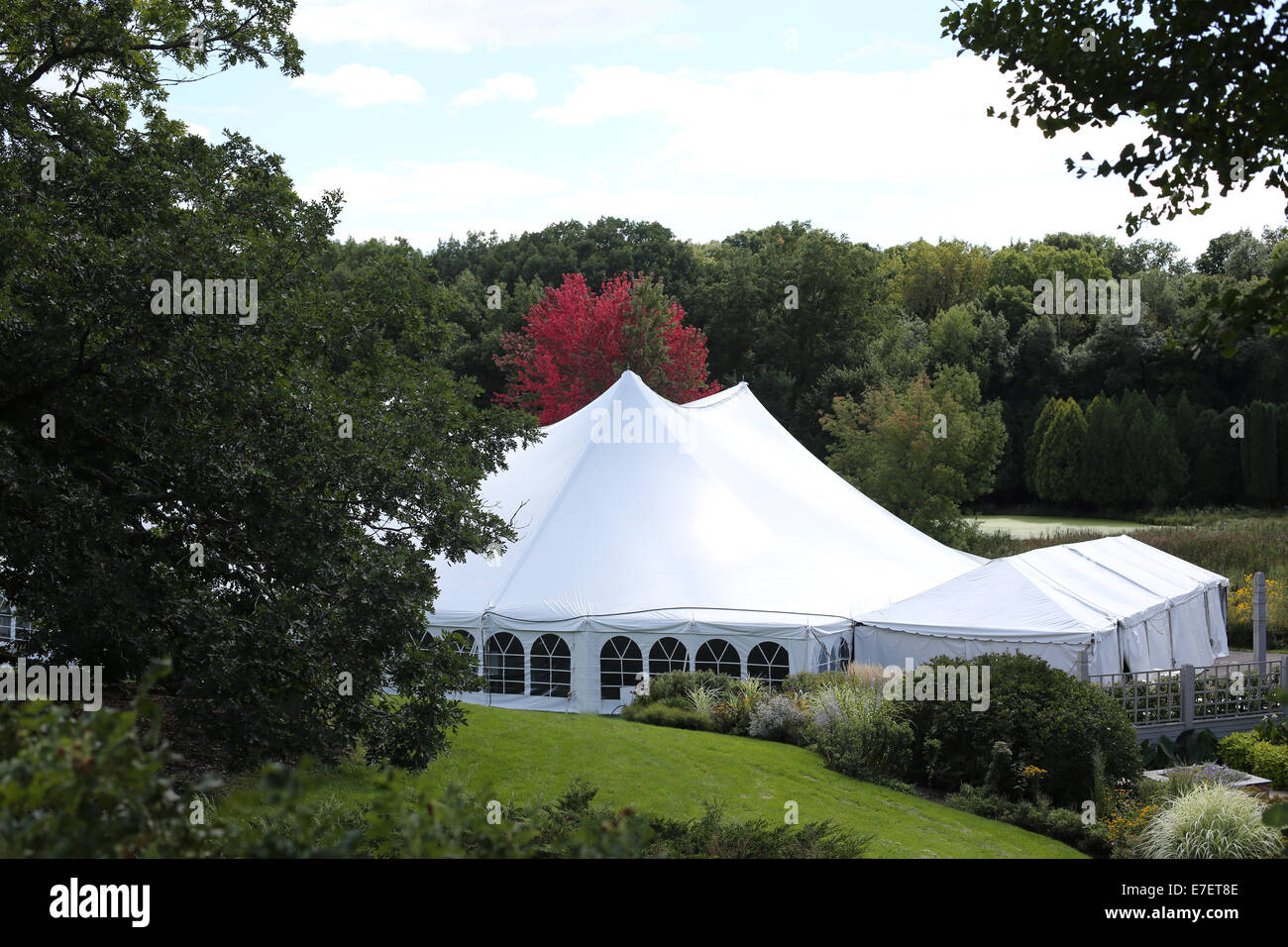 A large white wedding tent in a beautiful outdoor setting Stock Photo ...