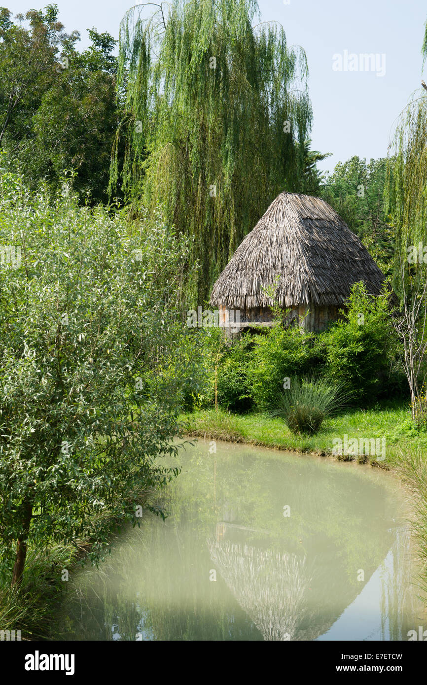 thatched hut on the river bank Stock Photo - Alamy