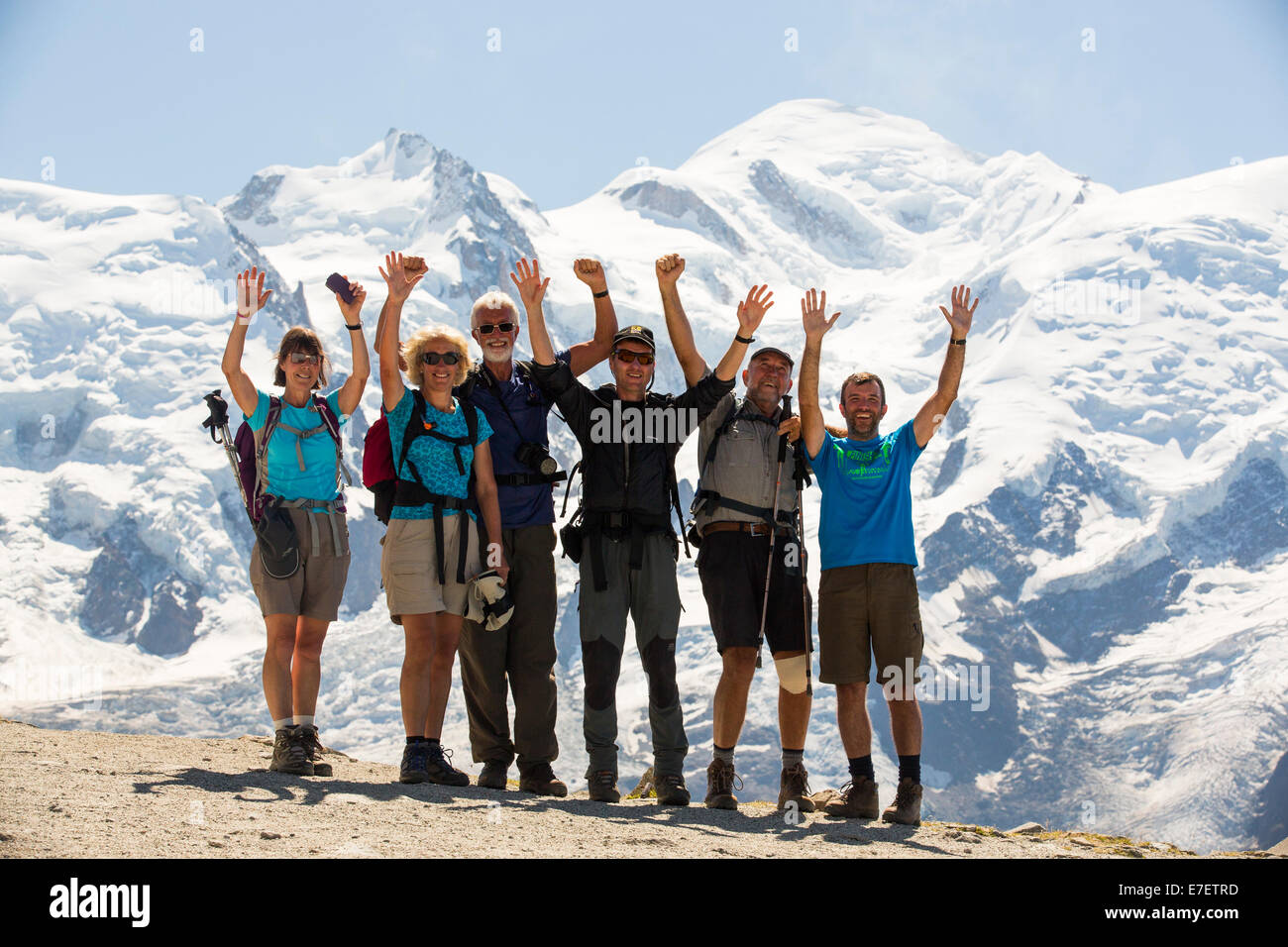 Walkers on the summit of Le Brevent, Aiguille Rouge above Chamonix ...