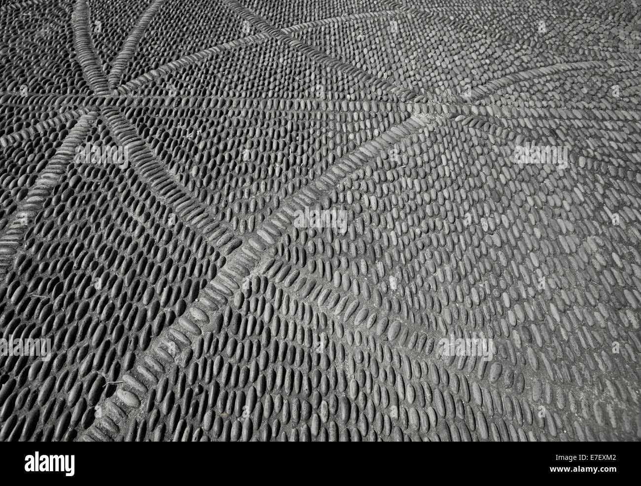 pebble paving with smooth pattern Stock Photo - Alamy