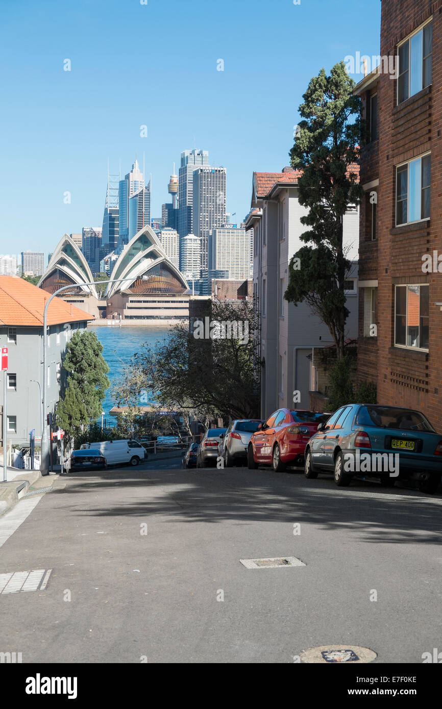 Looking across the harbor to the Sydney Opera House between suburban ...