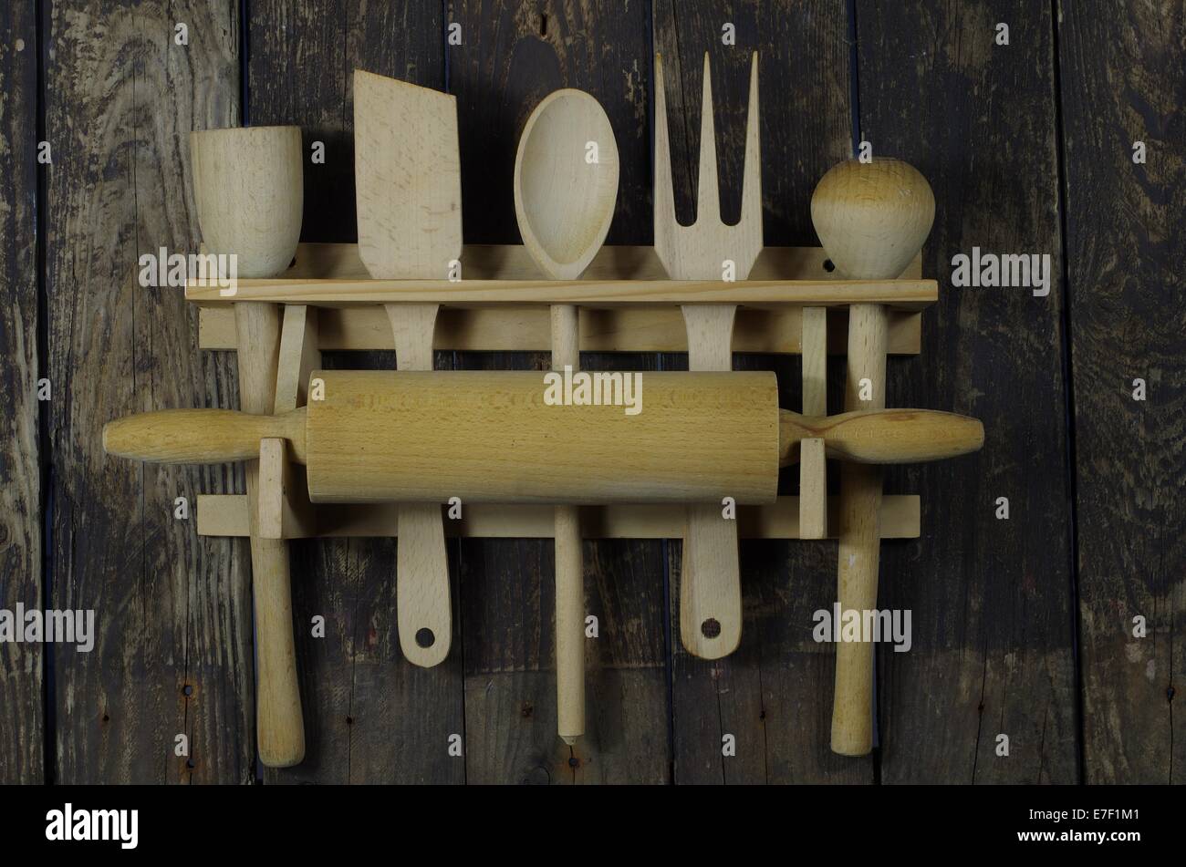 wooden kitchen accessories on background of board Stock Photo - Alamy