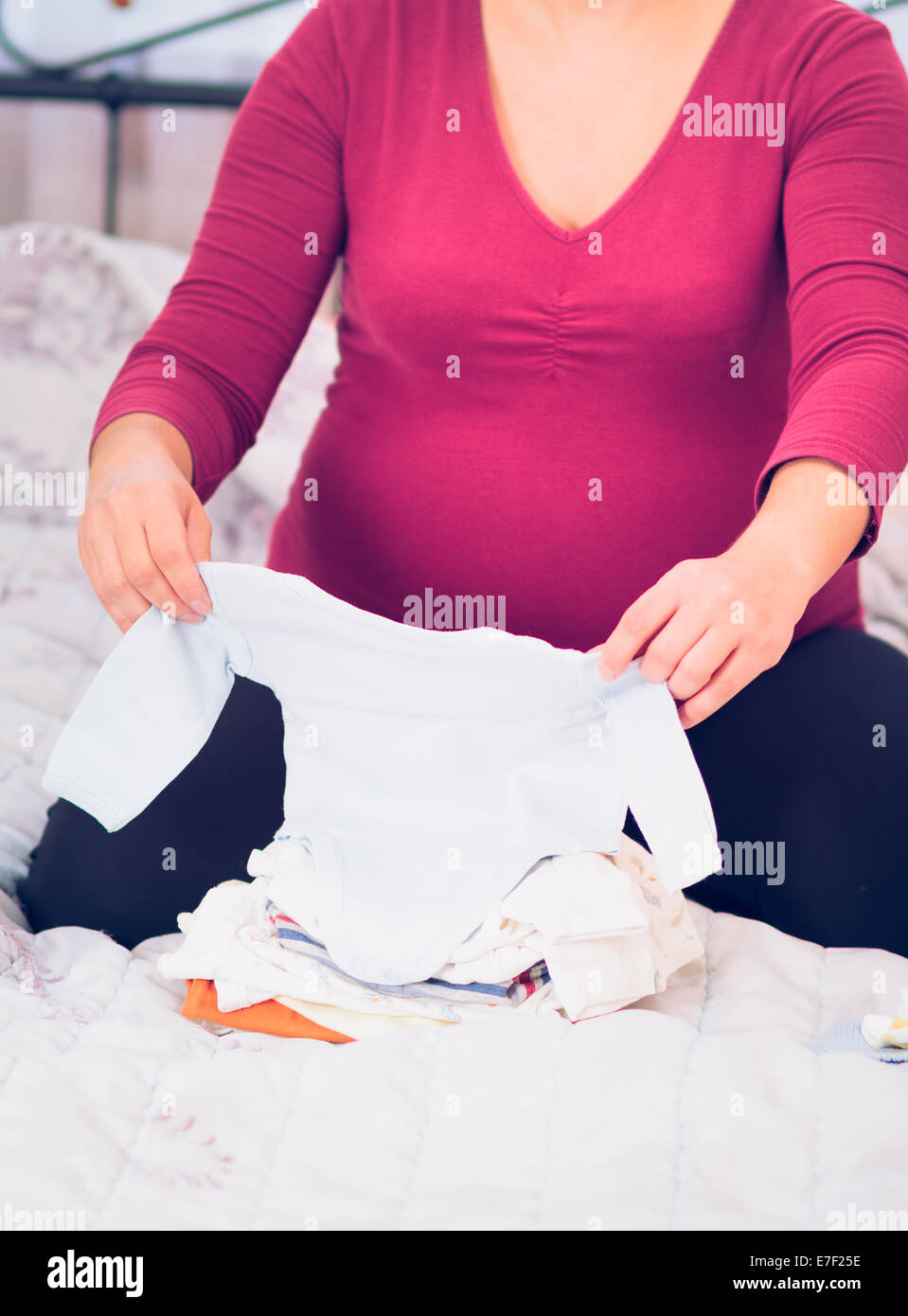 Pregnant woman packing hospital bag preparing for labor Stock Photo - Alamy