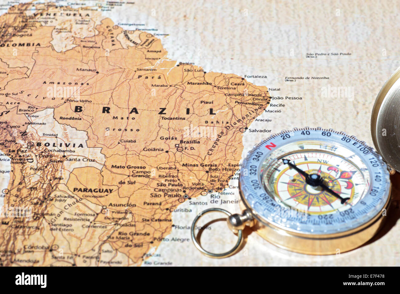 Compass on a map pointing at Brazil, planning a travel destination ...