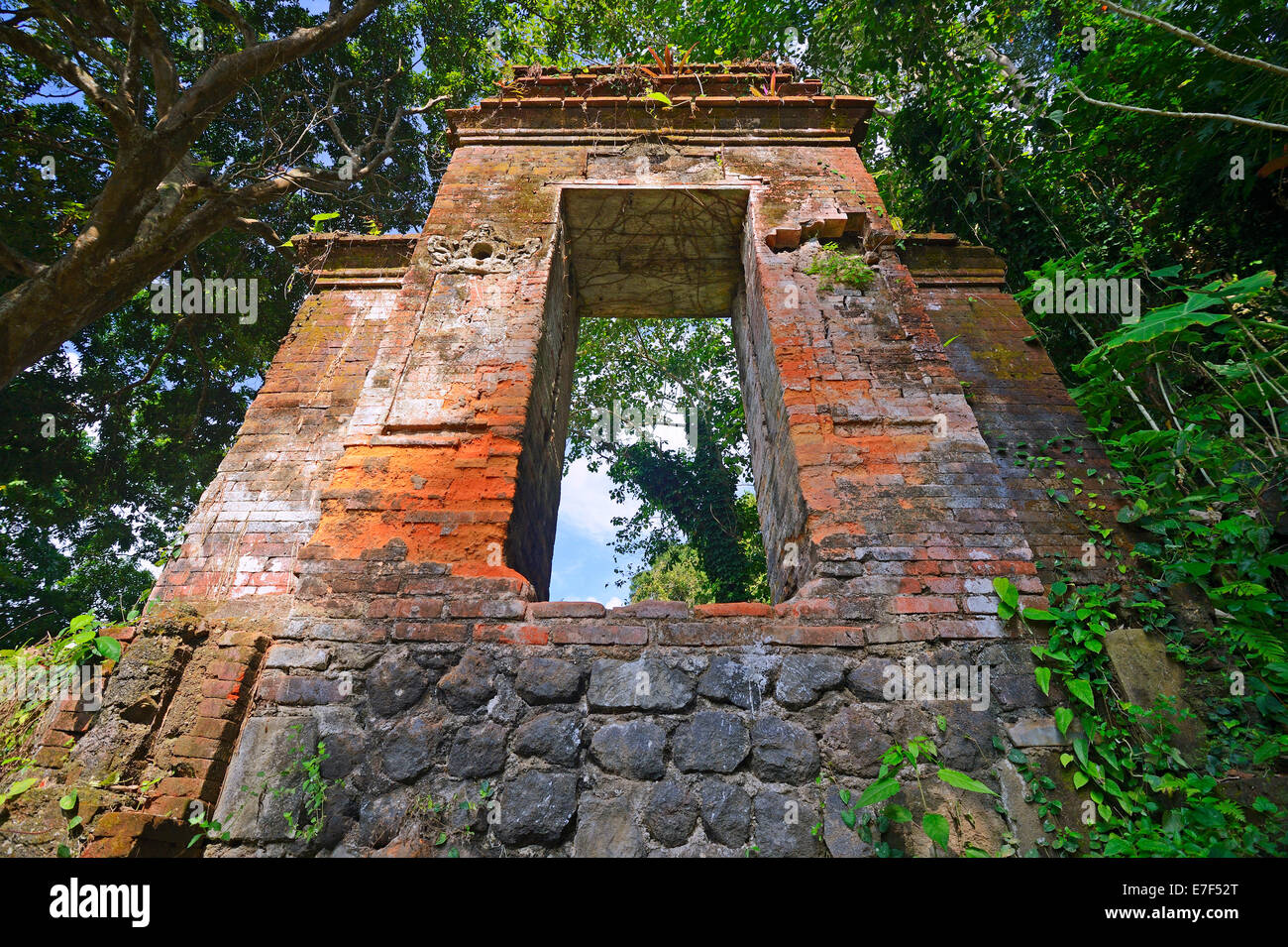 Old, dilapidated entrance gate at the Tirta Gangga Water Temple, Bali ...
