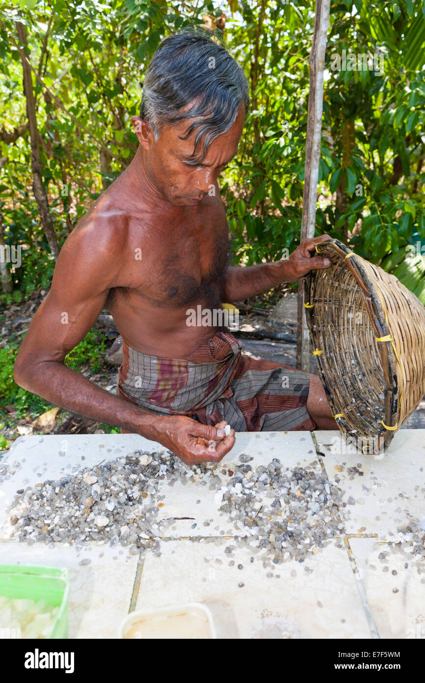Labourer sorting moonstones from the sand, Moonstone Mine, Nindana ...