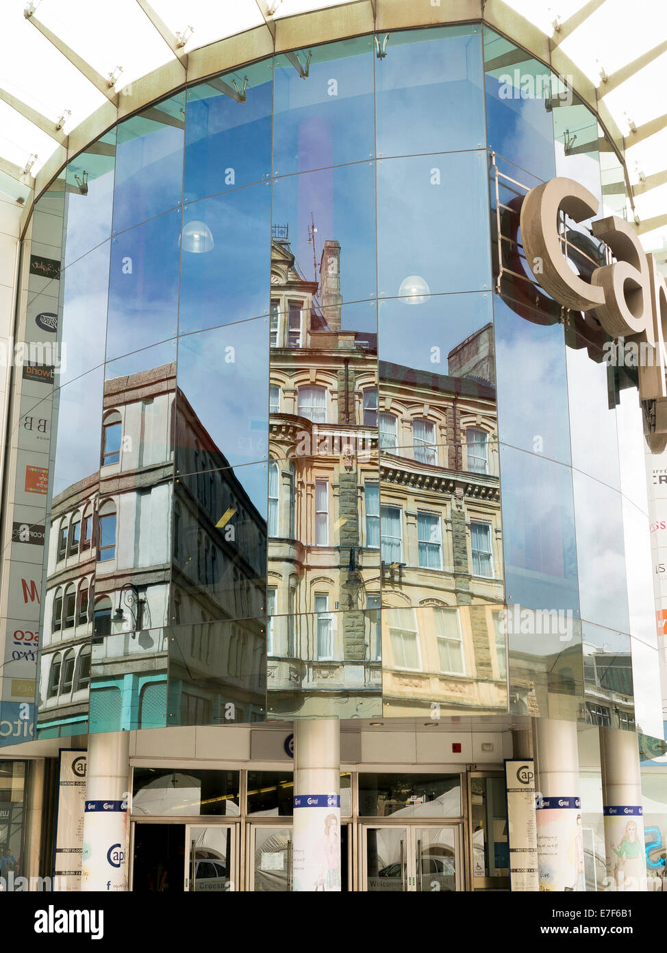 The Victorian buildings of Queen Street, Cardiff reflected in the glass ...