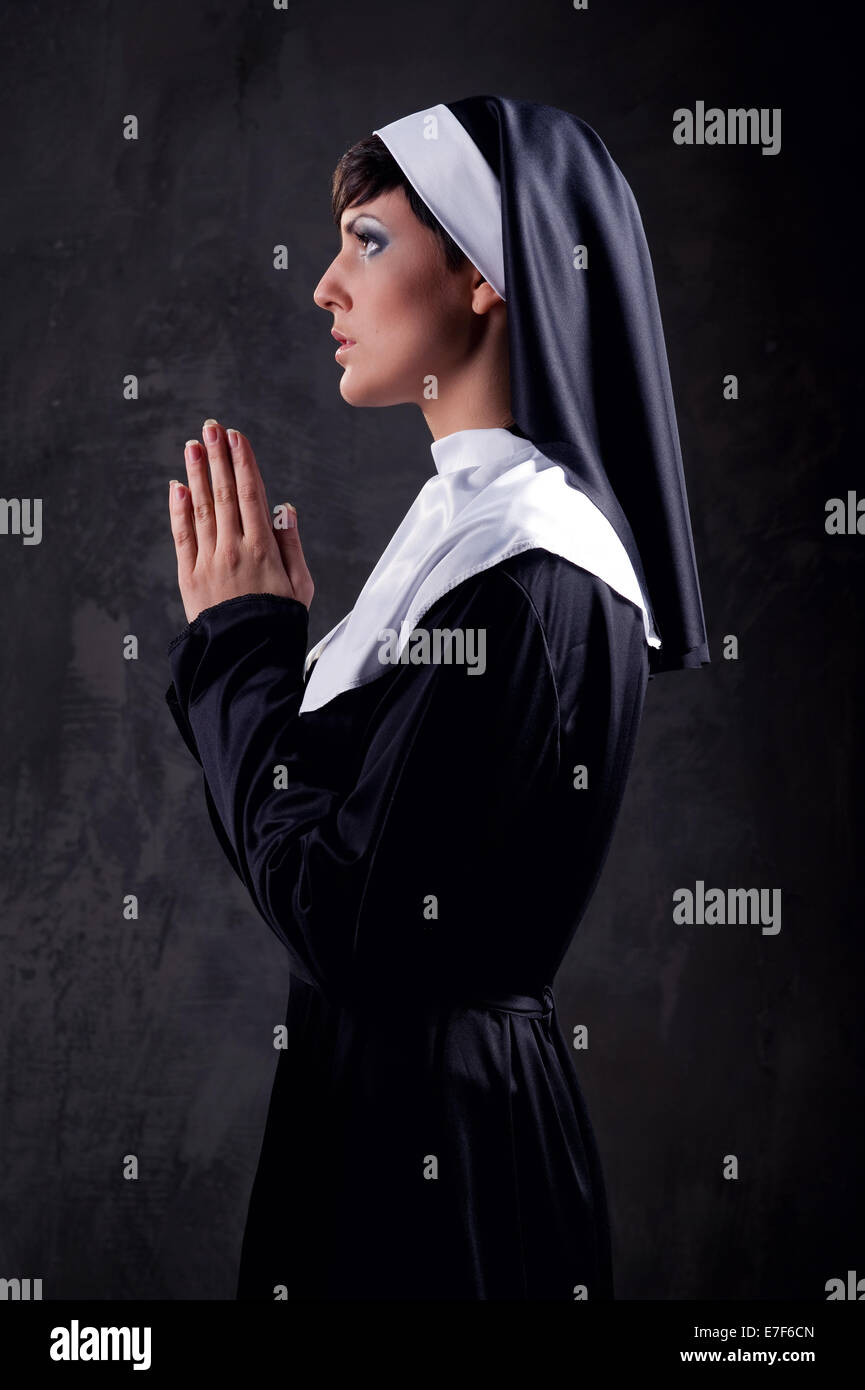 Young attractive nun praying hi-res stock photography and images - Alamy