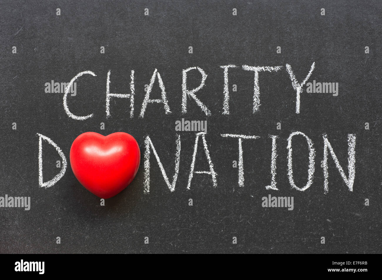 charity donation phrase handwritten on school blackboard with heart ...
