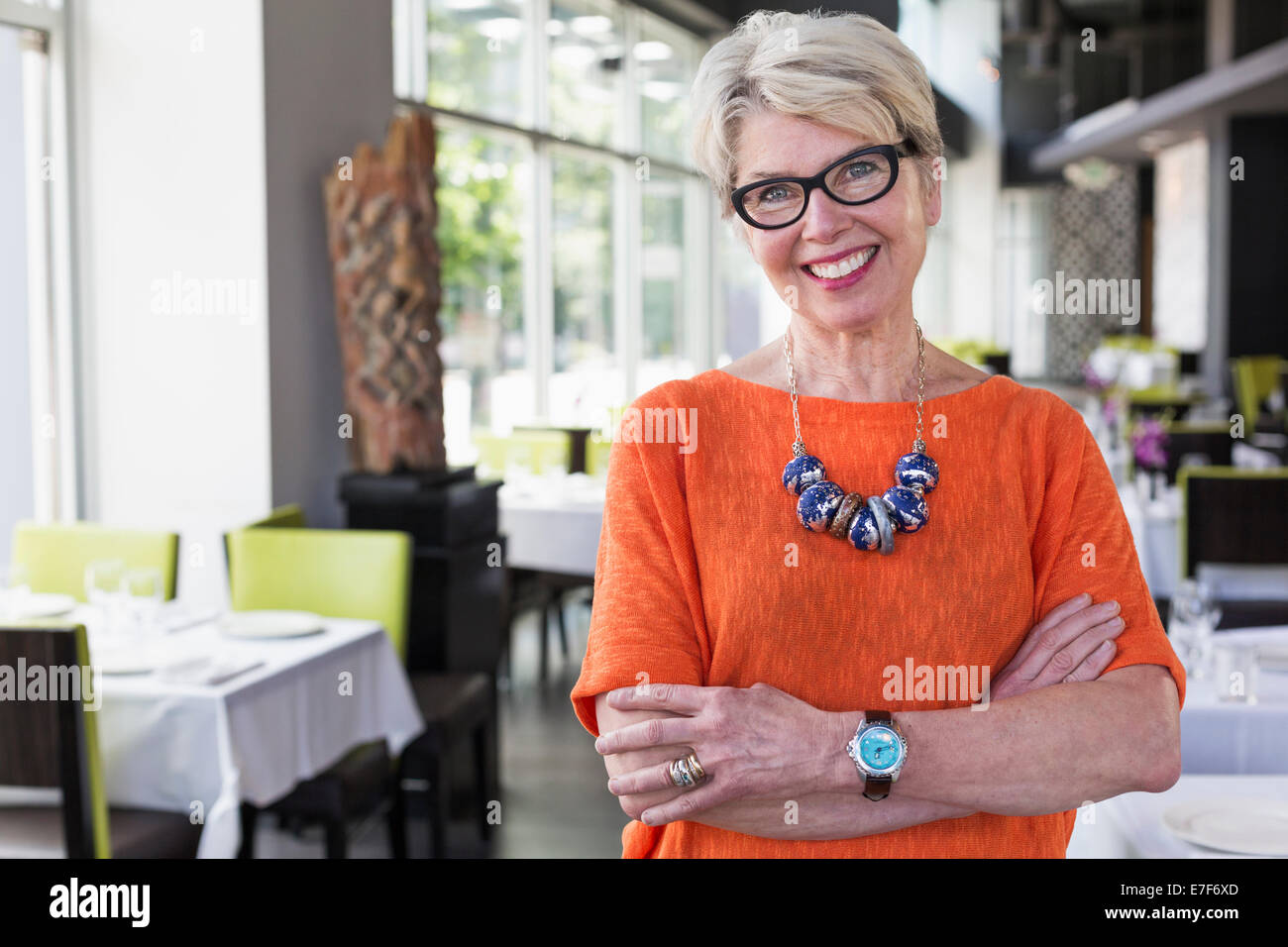 Caucasian woman smiling in restaurant Stock Photo - Alamy