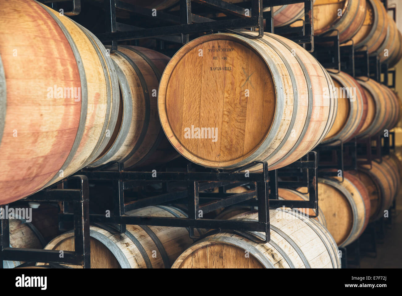 Wine barrels aging Stock Photo - Alamy