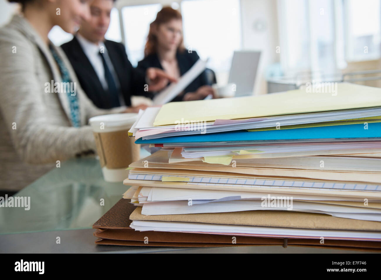Stack of papers on desk in office Stock Photo - Alamy