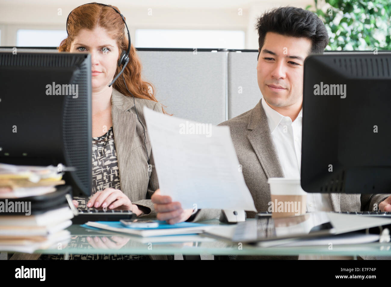Business people working at desk Stock Photo - Alamy