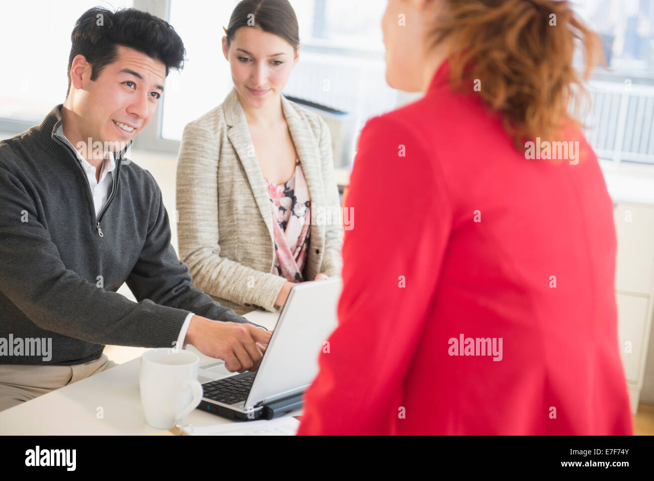 Business people talking in office Stock Photo - Alamy