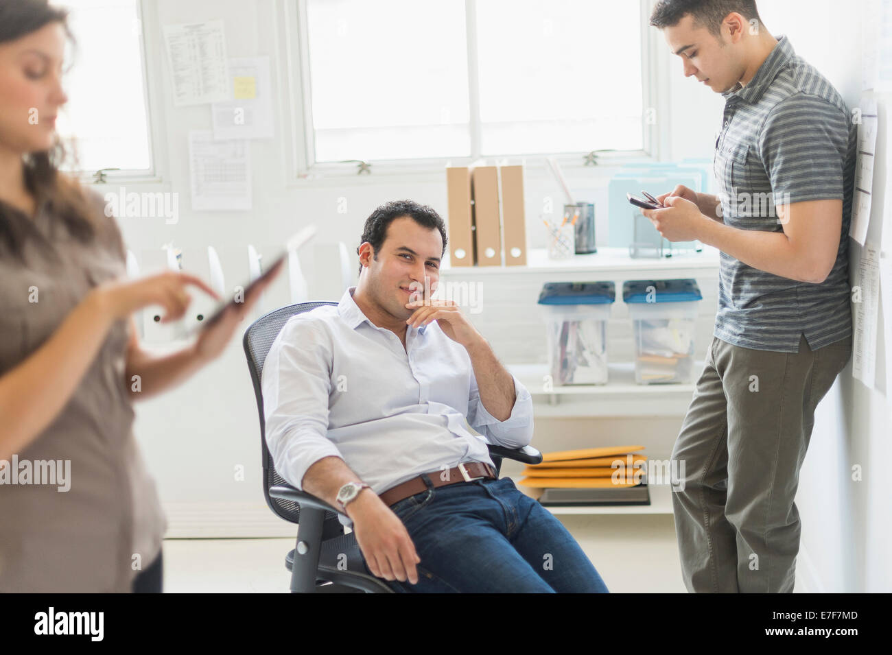 Smiling hispanic businesswoman sitting hi-res stock photography and ...