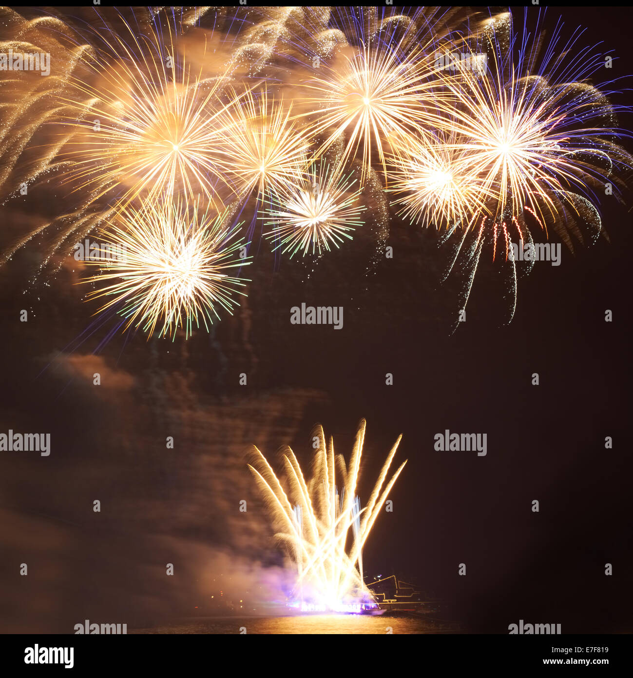 Red colorful fireworks on the black sky background Stock Photo - Alamy