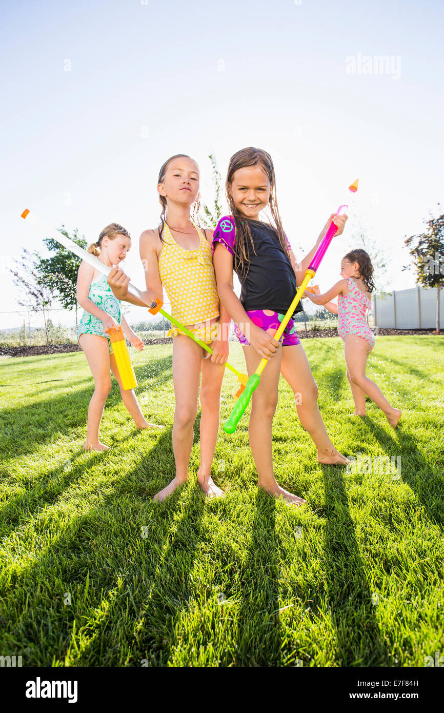 Caucasian girls playing in backyard Stock Photo - Alamy