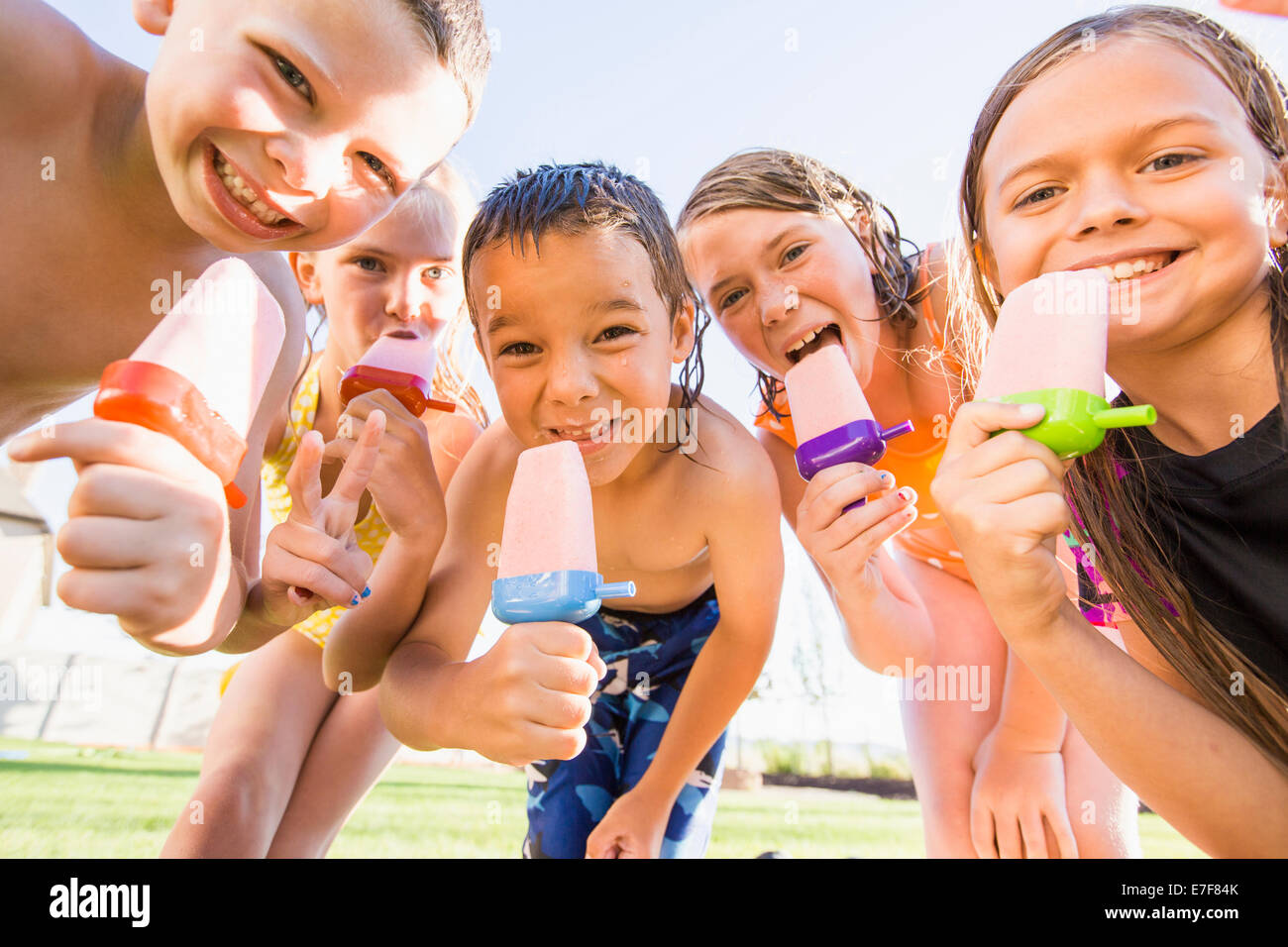 Girl licking popsicle hi-res stock photography and images - Alamy
