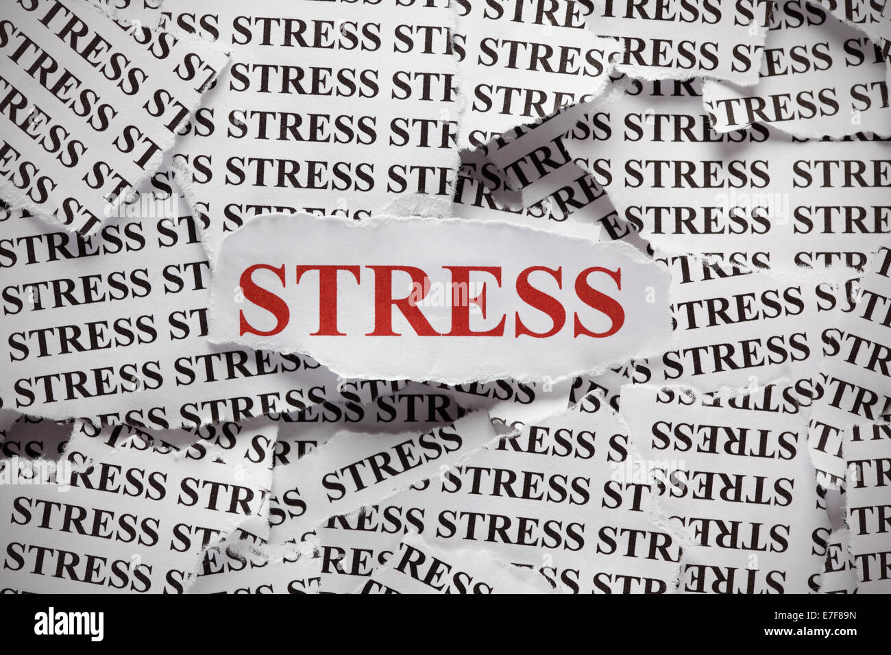Torn pieces of paper with the word "Stress". Concept Image. Close-up ...