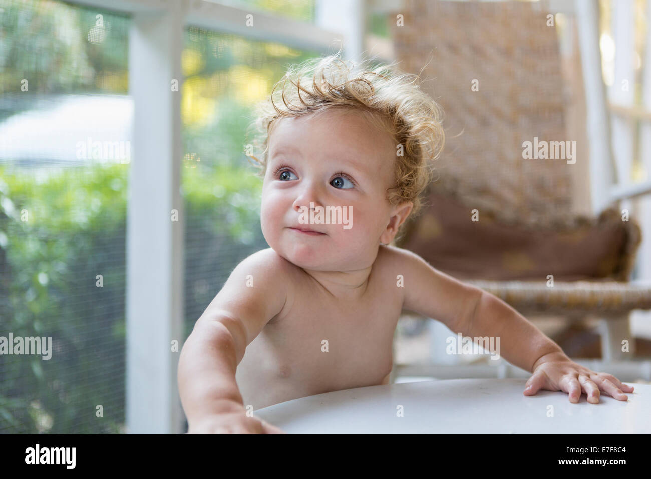 Caucasian toddler standing on porch Stock Photo - Alamy