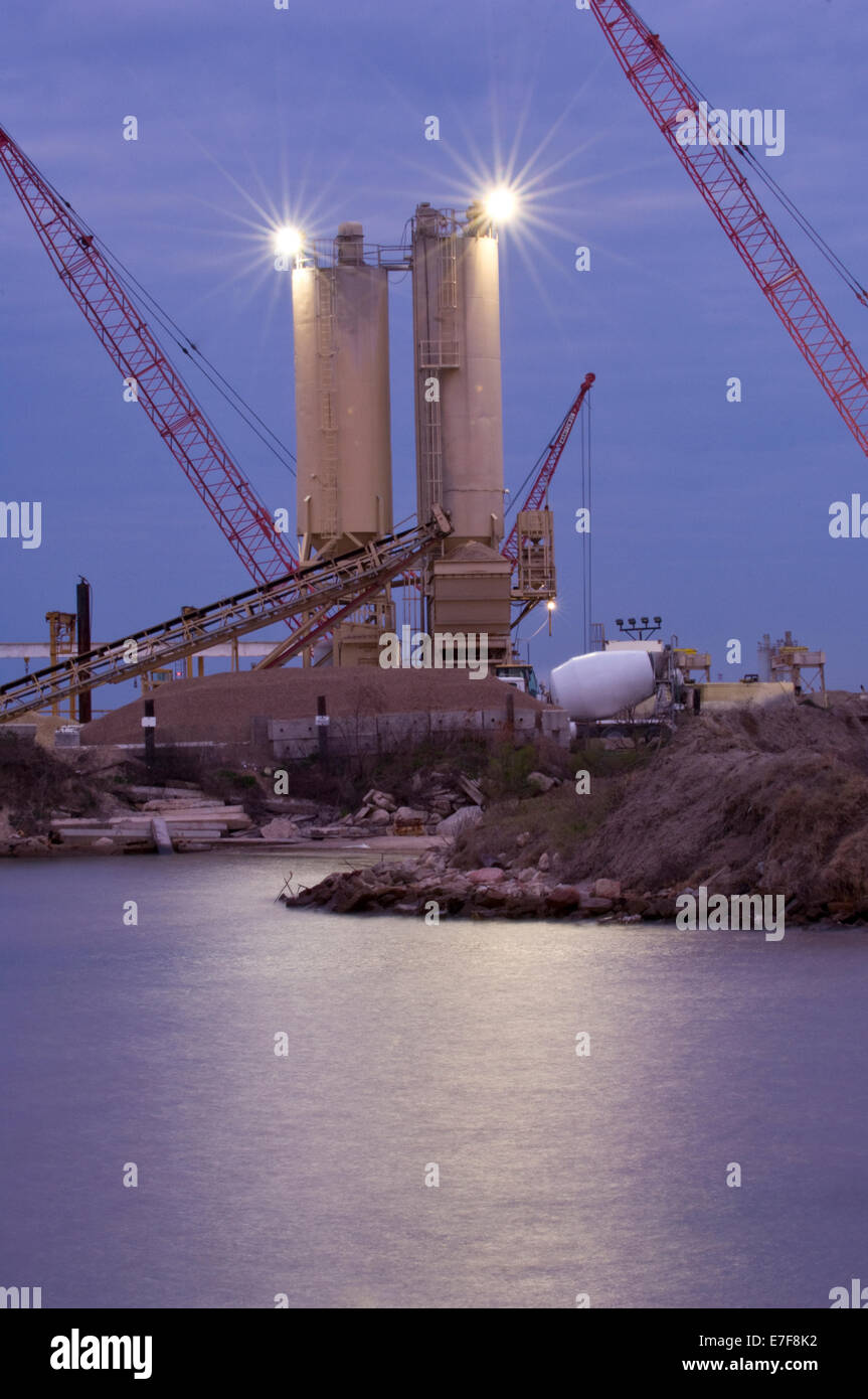 Factory overlooking lake Stock Photo - Alamy