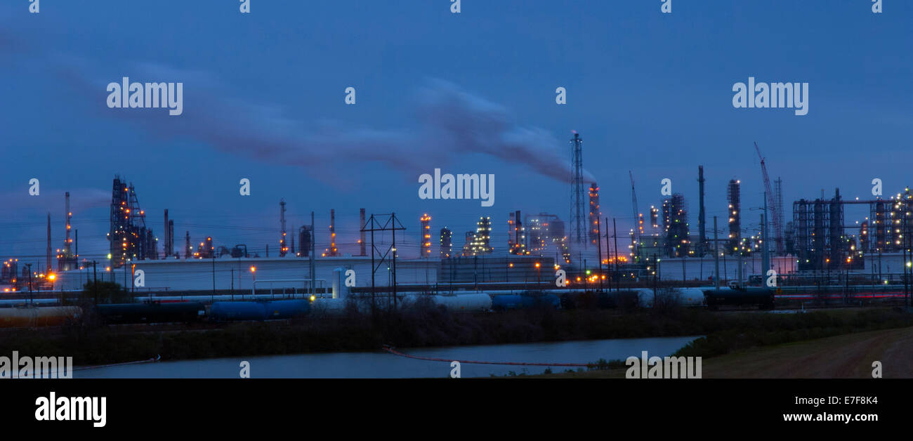 Factory near lake illuminated at night Stock Photo - Alamy