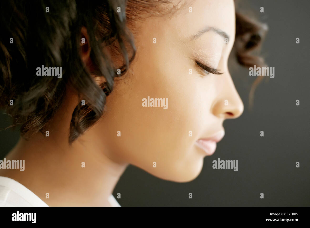 Woman face looking down profile hi-res stock photography and images - Alamy