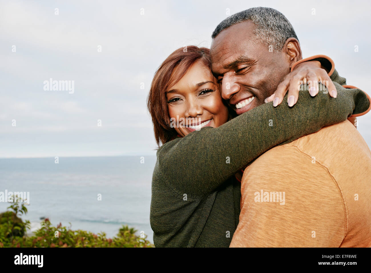 Black couple hugging outdoors Stock Photo - Alamy