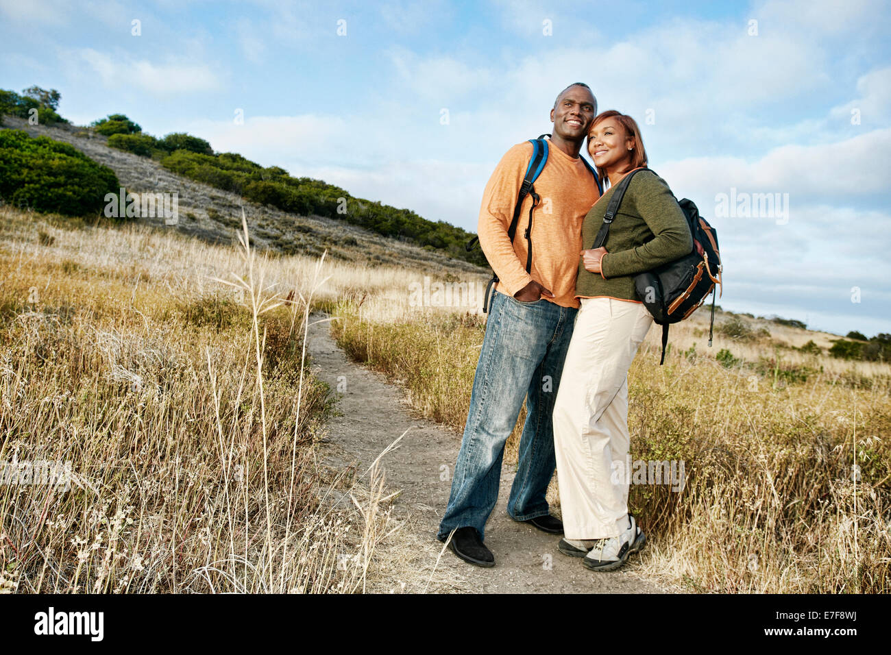 Black couple hugging on rural path Stock Photo - Alamy