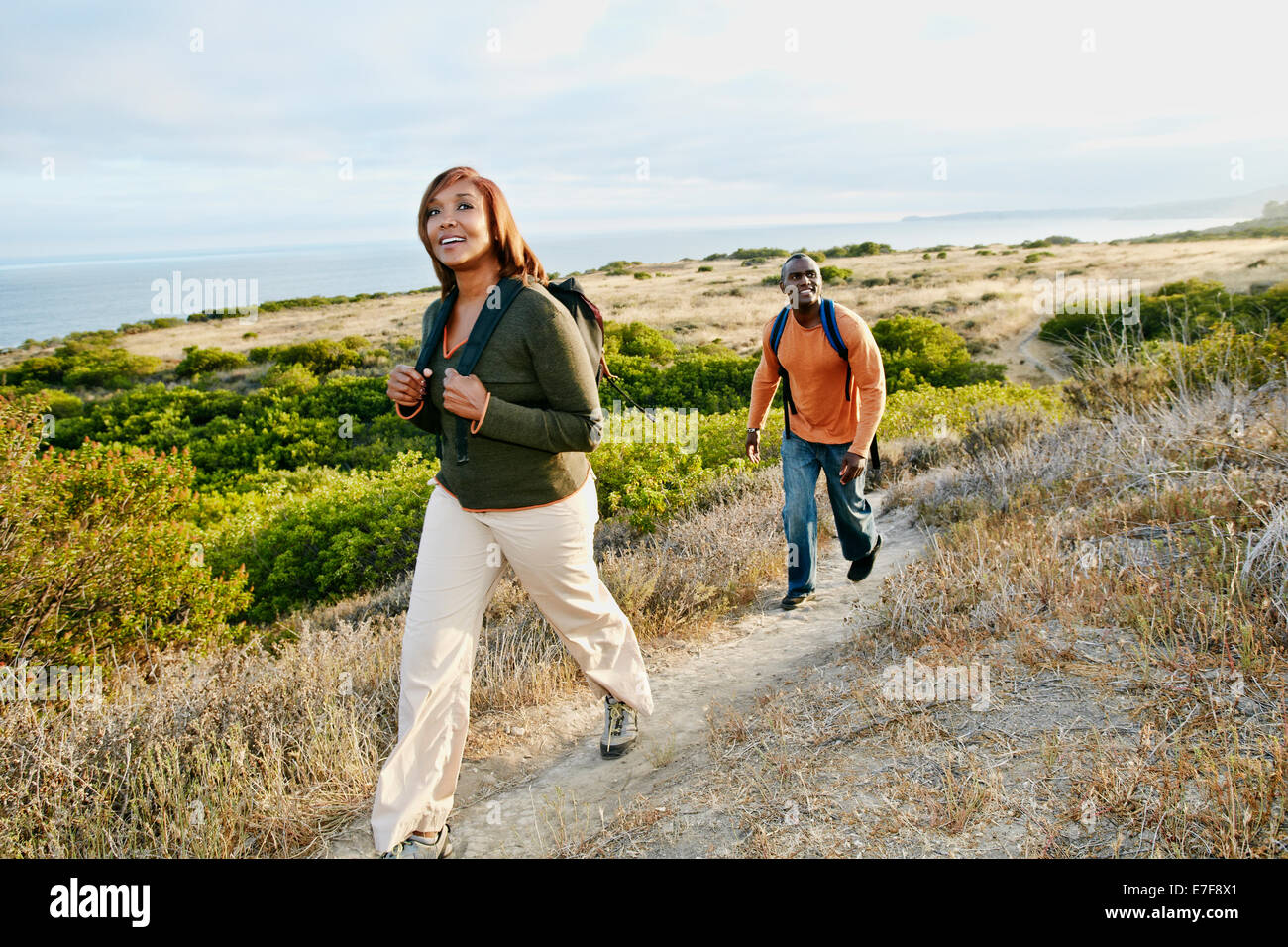 Black couple hiking on rural path Stock Photo - Alamy