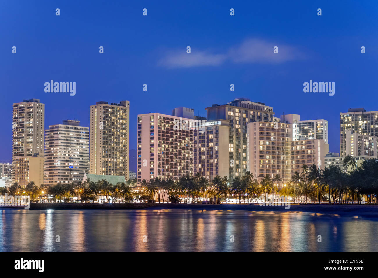 Illuminated city skyline on waterfront, Honolulu, Hawaii, United States ...