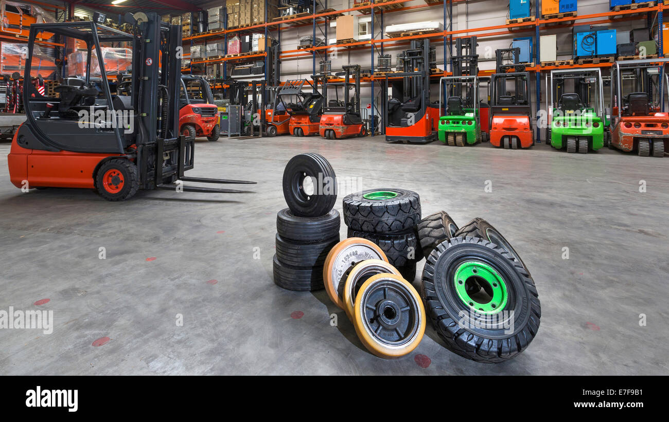 Forklift tires in warehouse Stock Photo - Alamy