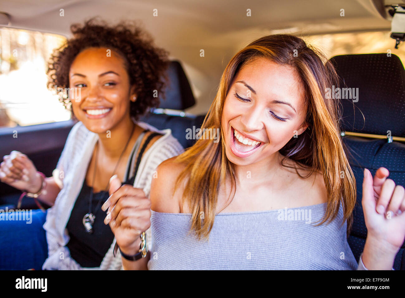 Women dancing together in car Stock Photo - Alamy
