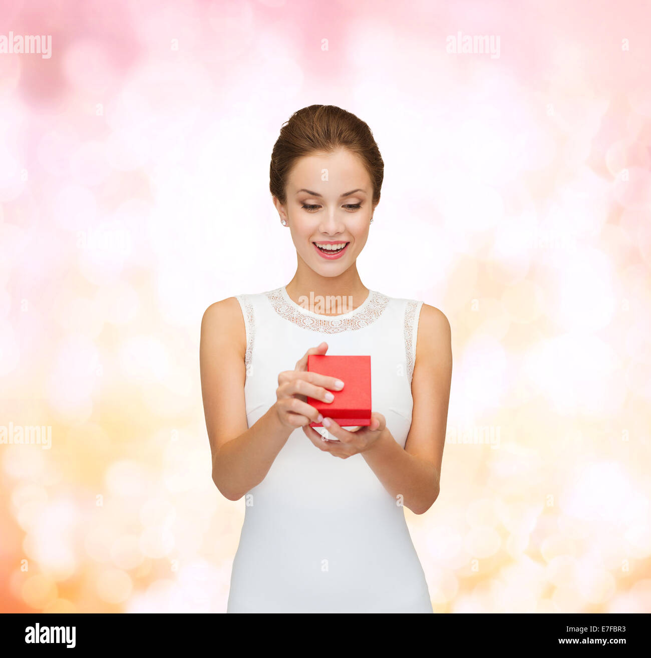Woman holding pink box hi-res stock photography and images - Alamy