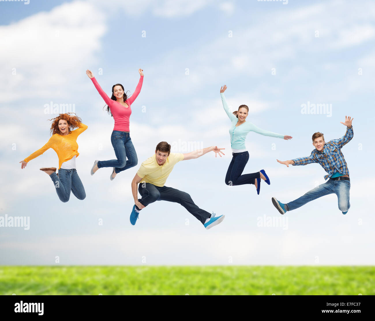 group of smiling teenagers jumping in air Stock Photo - Alamy
