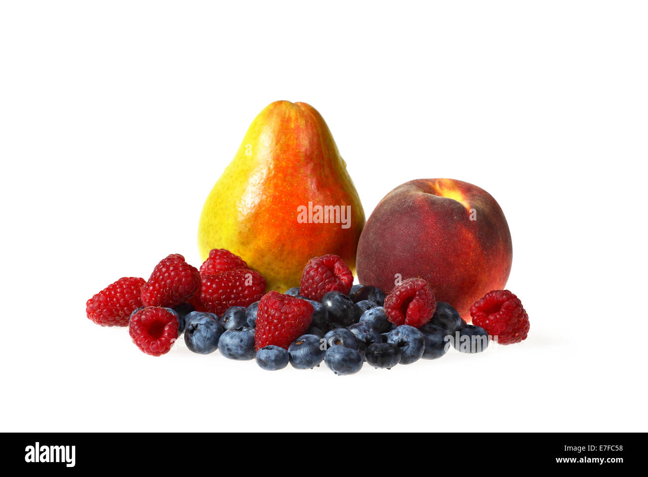 Pear, peach, blueberries and raspberries on white background with ...