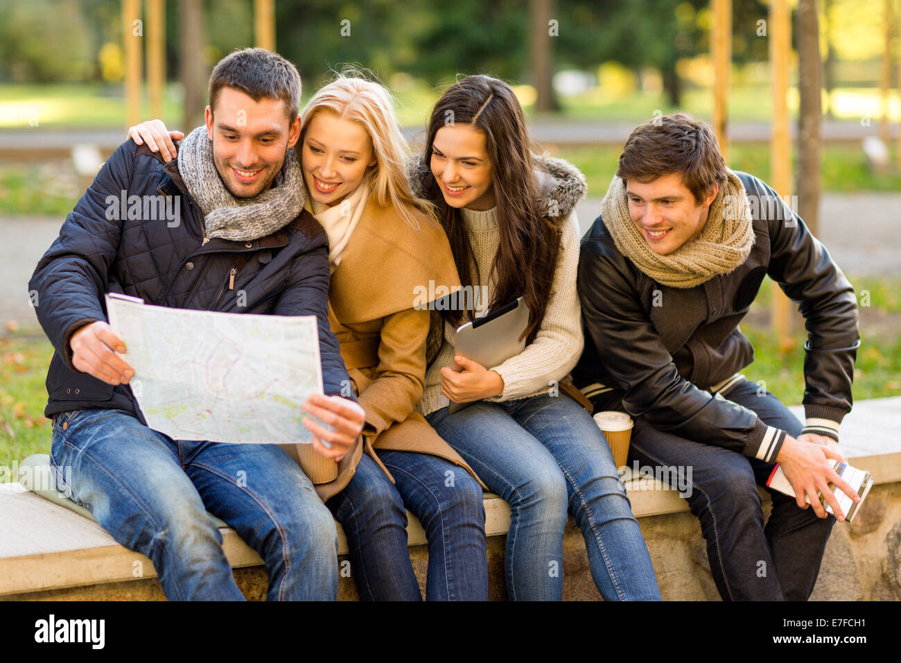 group of friends with map outdoors Stock Photo - Alamy