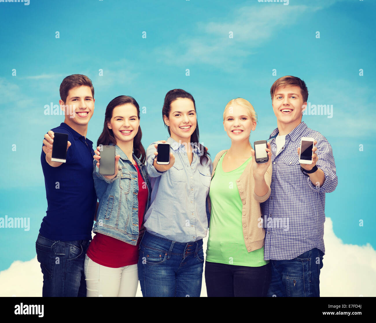 students showing blank smartphones screens Stock Photo - Alamy