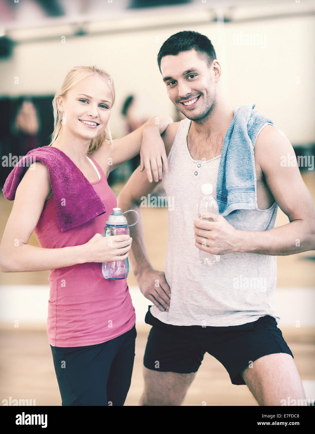 two smiling people in the gym Stock Photo - Alamy