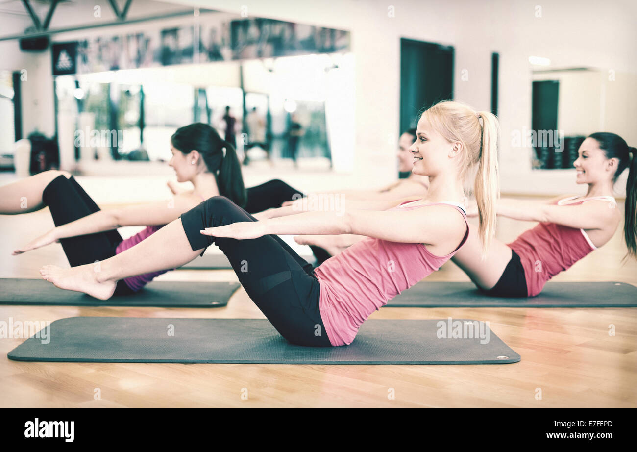 group of smiling women exercising in the gym Stock Photo - Alamy