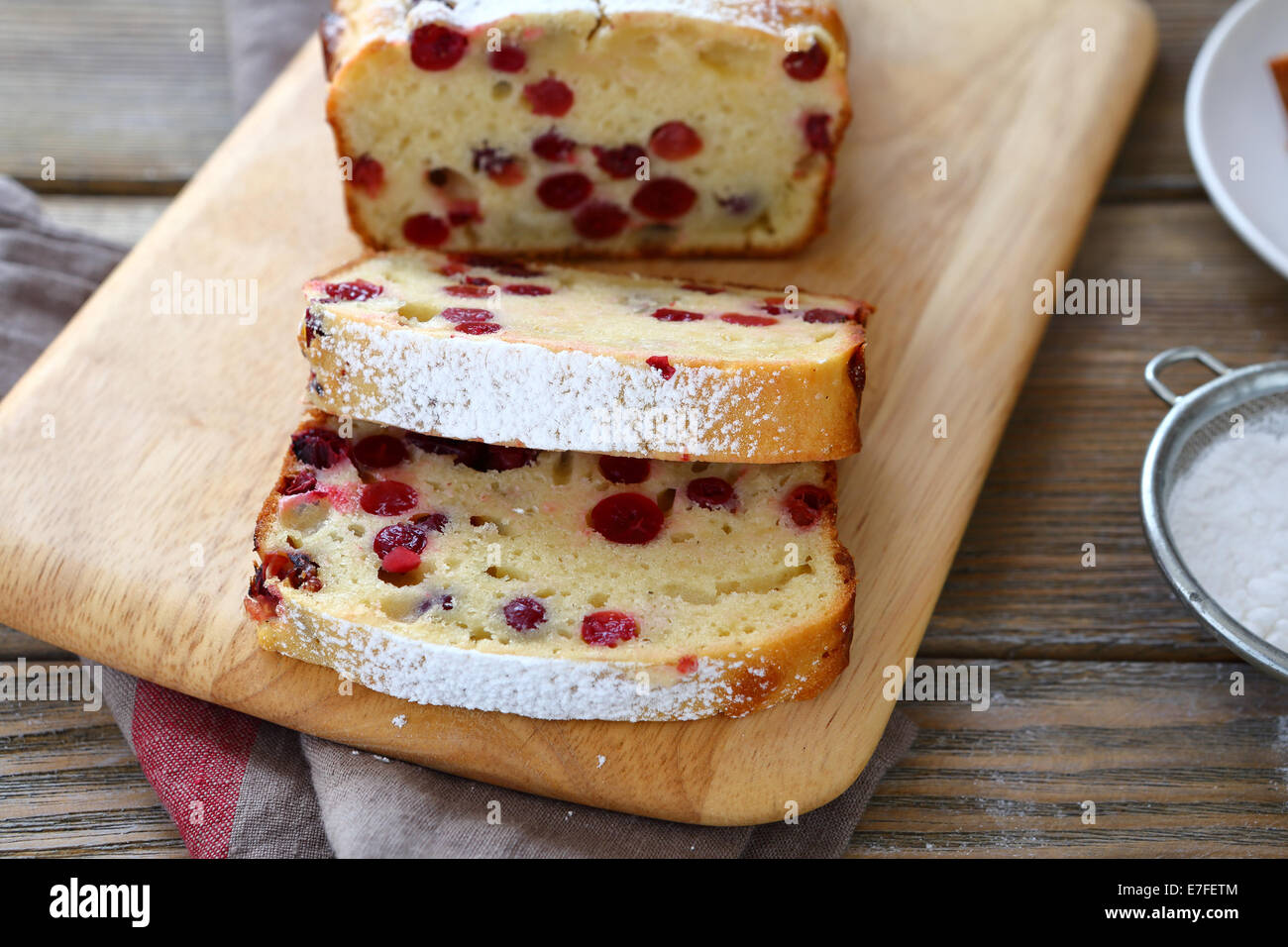 tasty cake cranberry cutting, close-up Stock Photo - Alamy