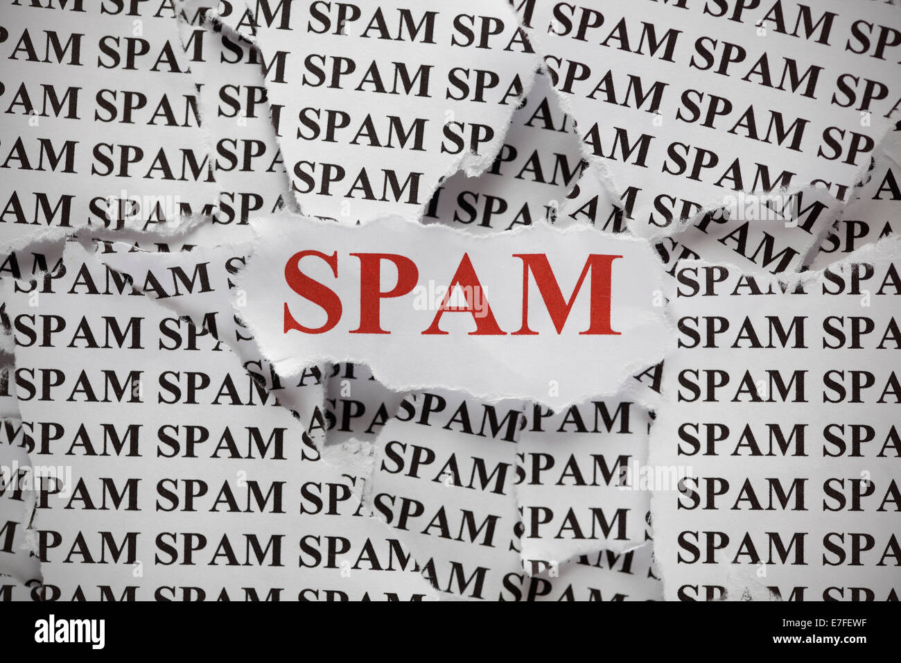 Torn pieces of paper with the word "Spam" and word "SPAM" in red color ...