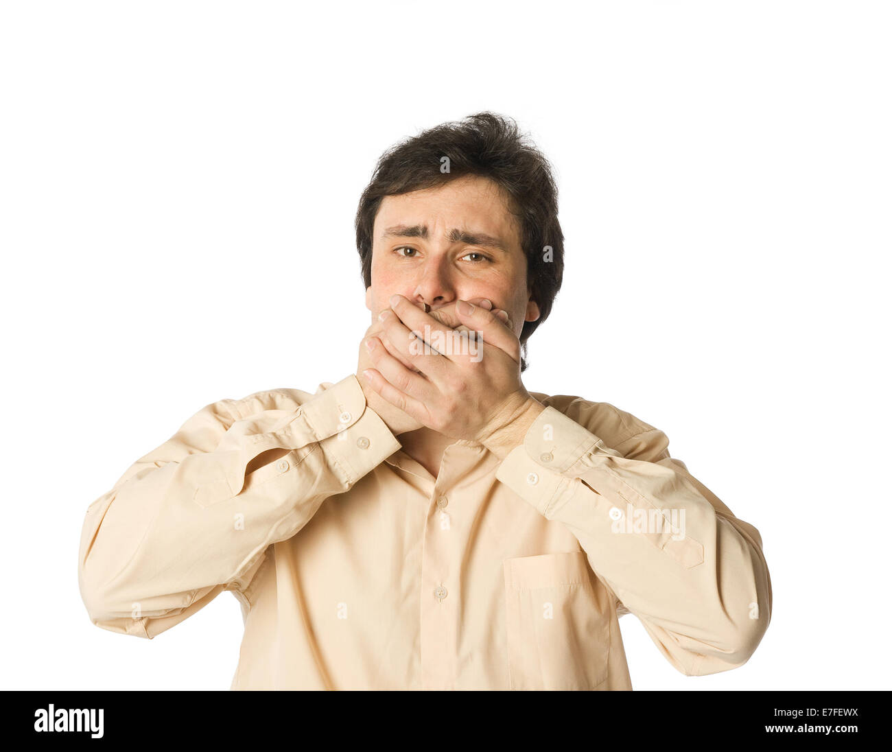 Man covering his mouth with hands, white background Stock Photo - Alamy